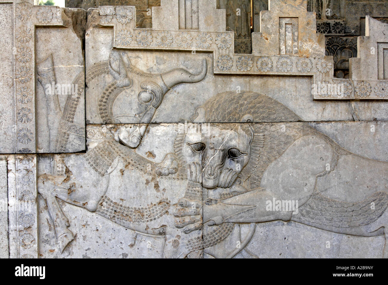 Scene from Persian mythology in the Apadana stairs, Persepolis, Iran ...