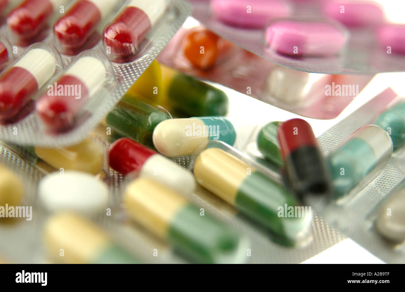 The arrangement features an assortment of capsules and tablets in ...