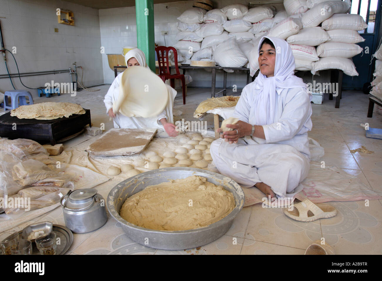 Women making bread in a traditional Baker's shop, Iran Stock Photo - Alamy