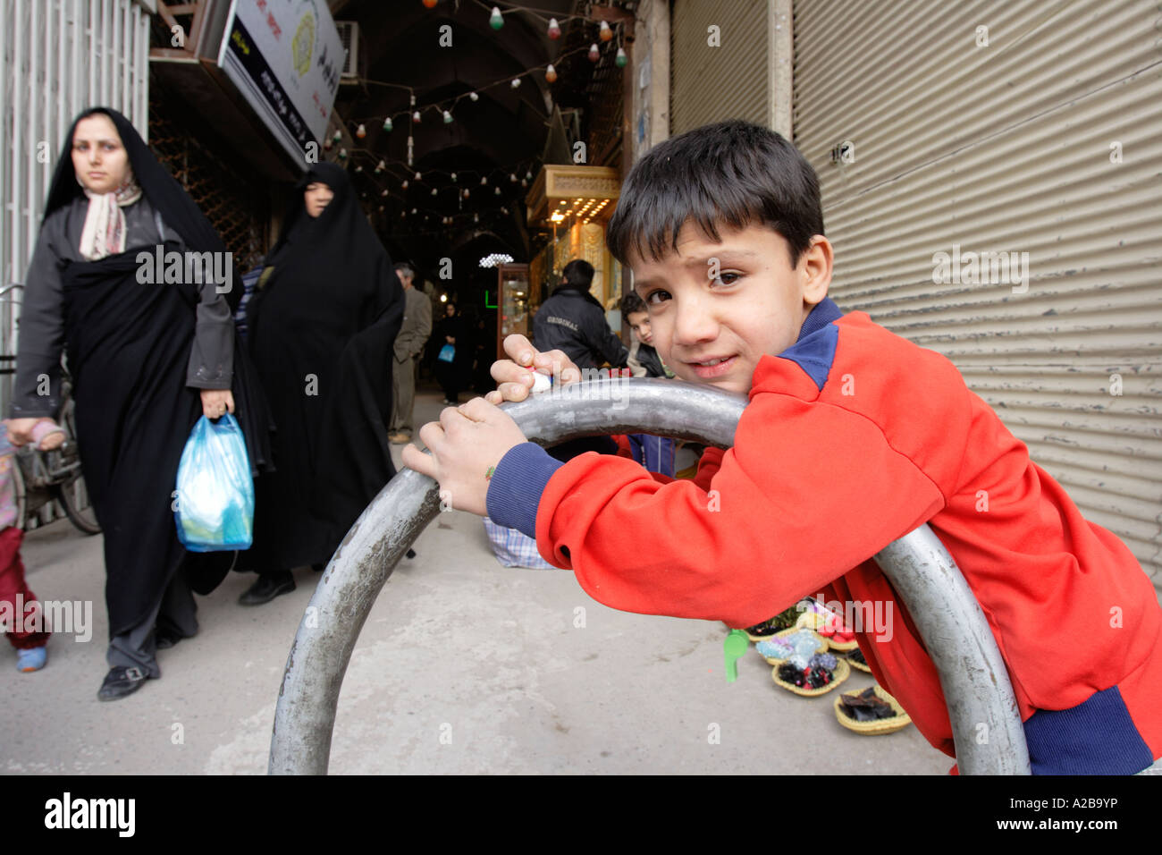 Portrait of a young boy in front of the Bazaar, Iran Stock Photo - Alamy