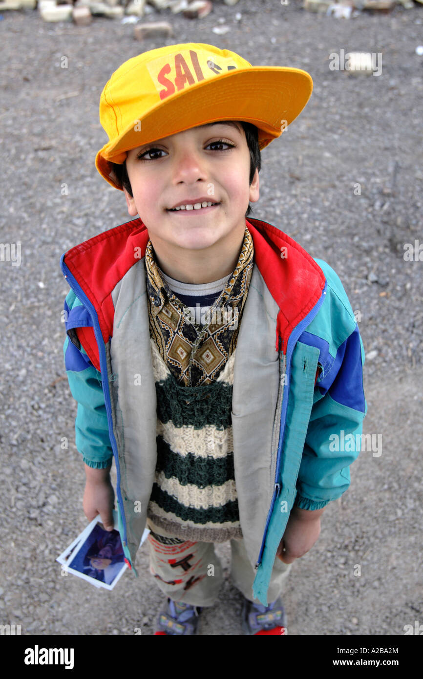 Iranian child holding a polaroid, Iran Stock Photo - Alamy
