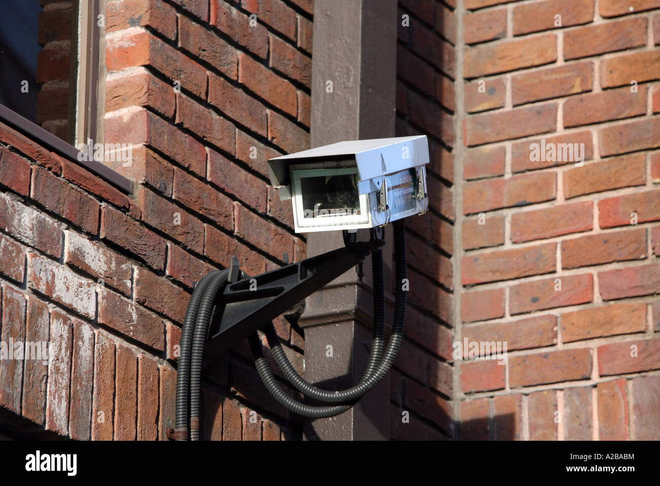 CCTV camera on side of office block Stock Photo - Alamy