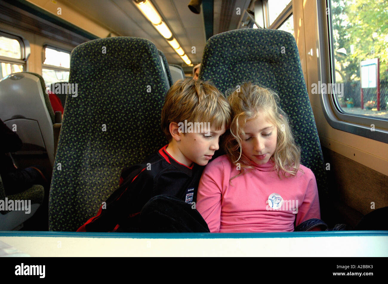 children travelling on a train Stock Photo - Alamy