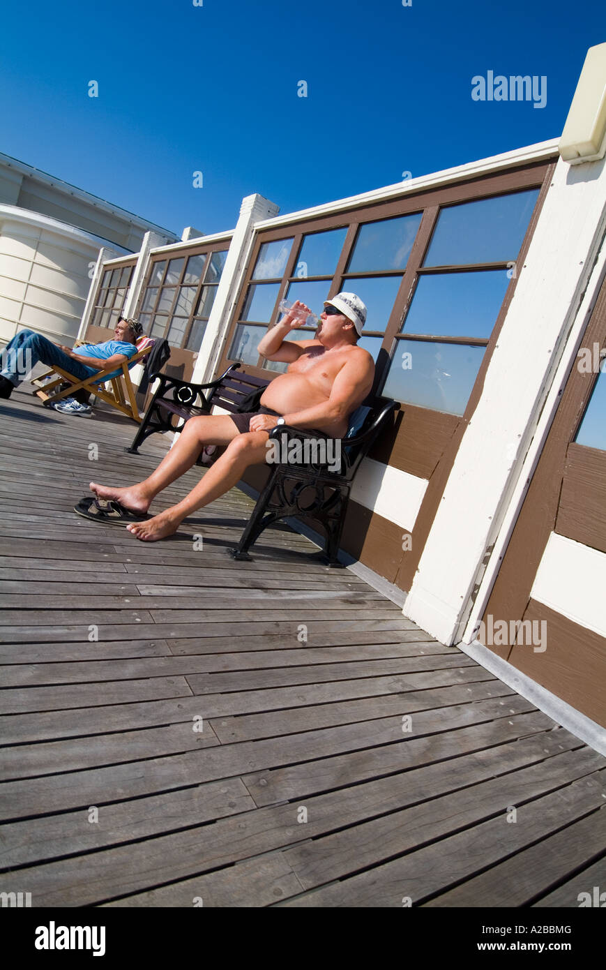 Fat man sunbathing hi-res stock photography and images - Alamy