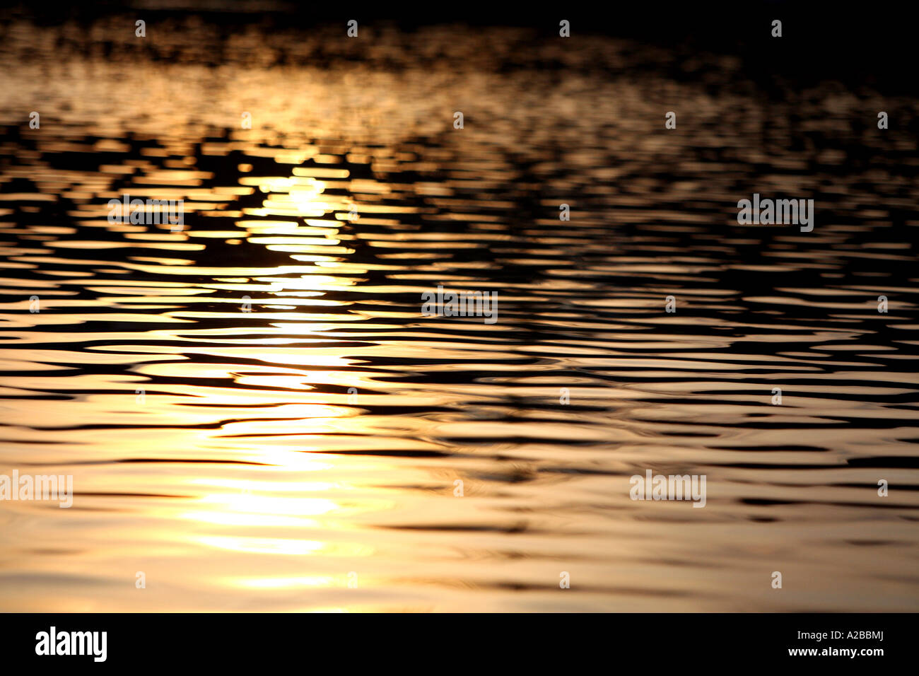 Sunset reflection on water Stock Photo - Alamy