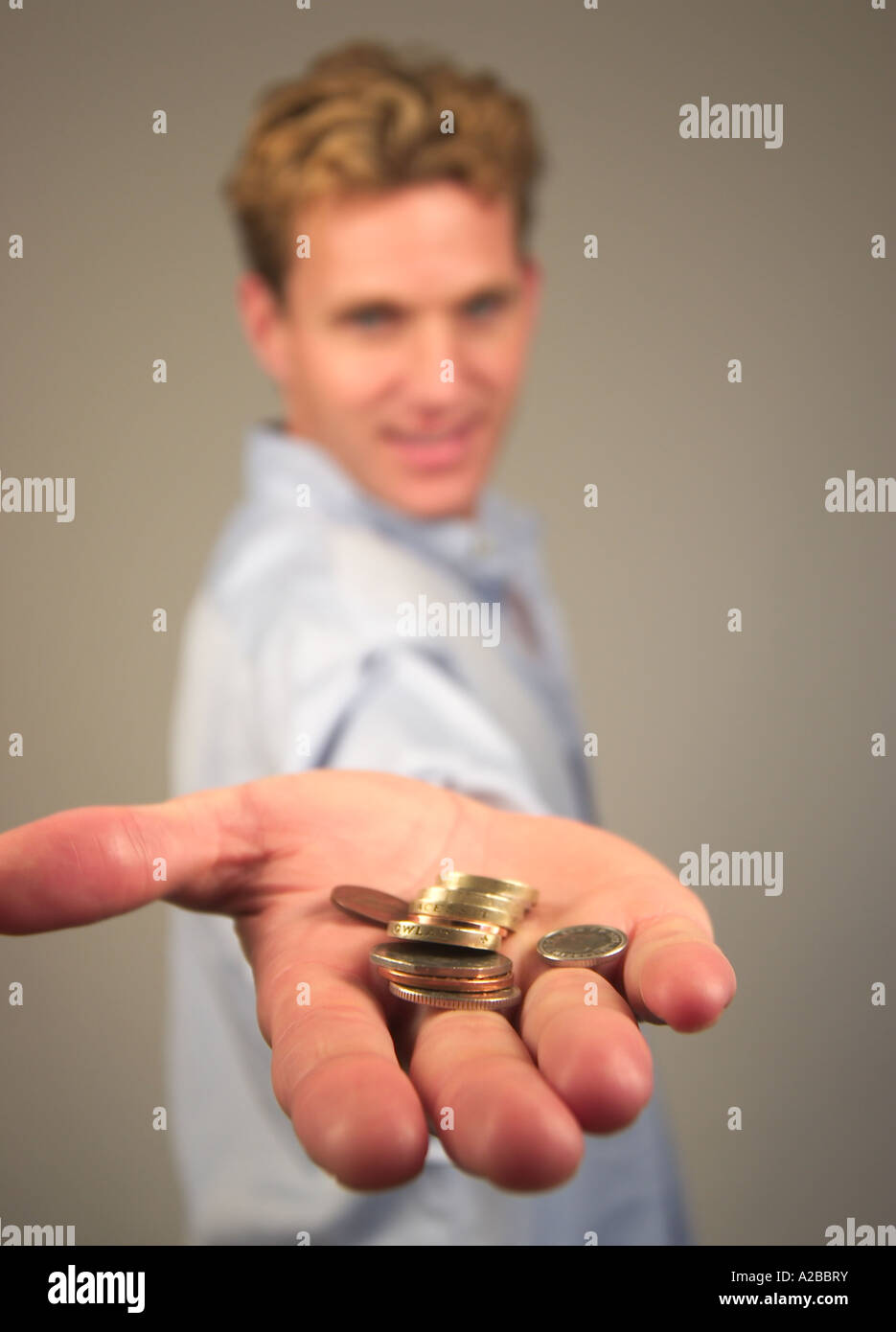 Handful of pound coins hi-res stock photography and images - Alamy