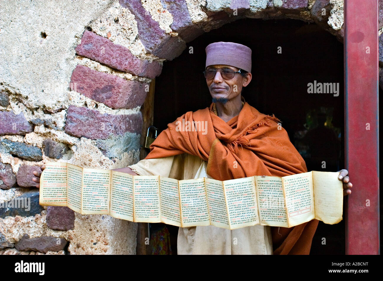 Ethiopian priest showing a scripture written in Amharic, Bahir Dar ...