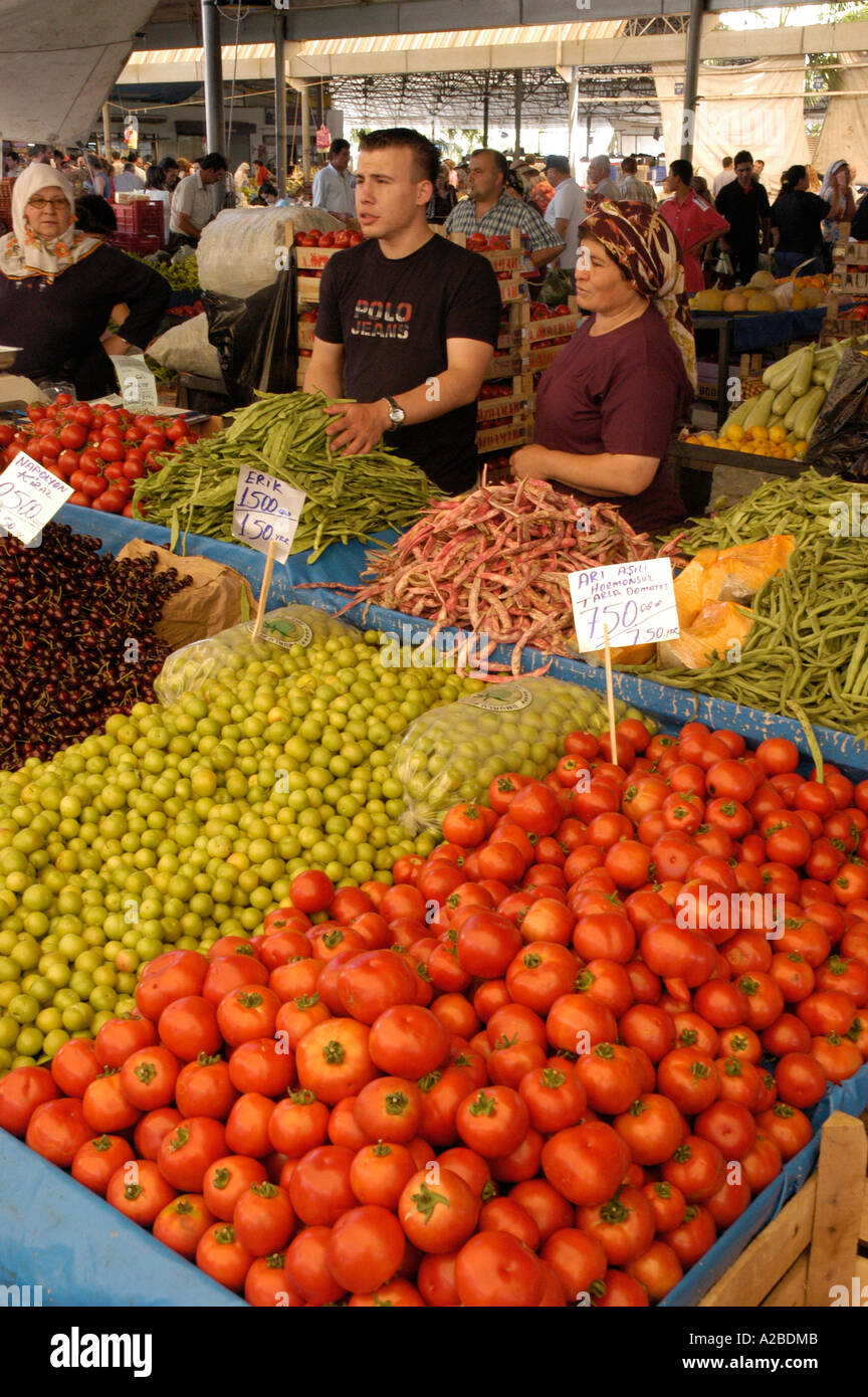 Local Turkish man selling fruit and vegetables at the market in Bodrum ...