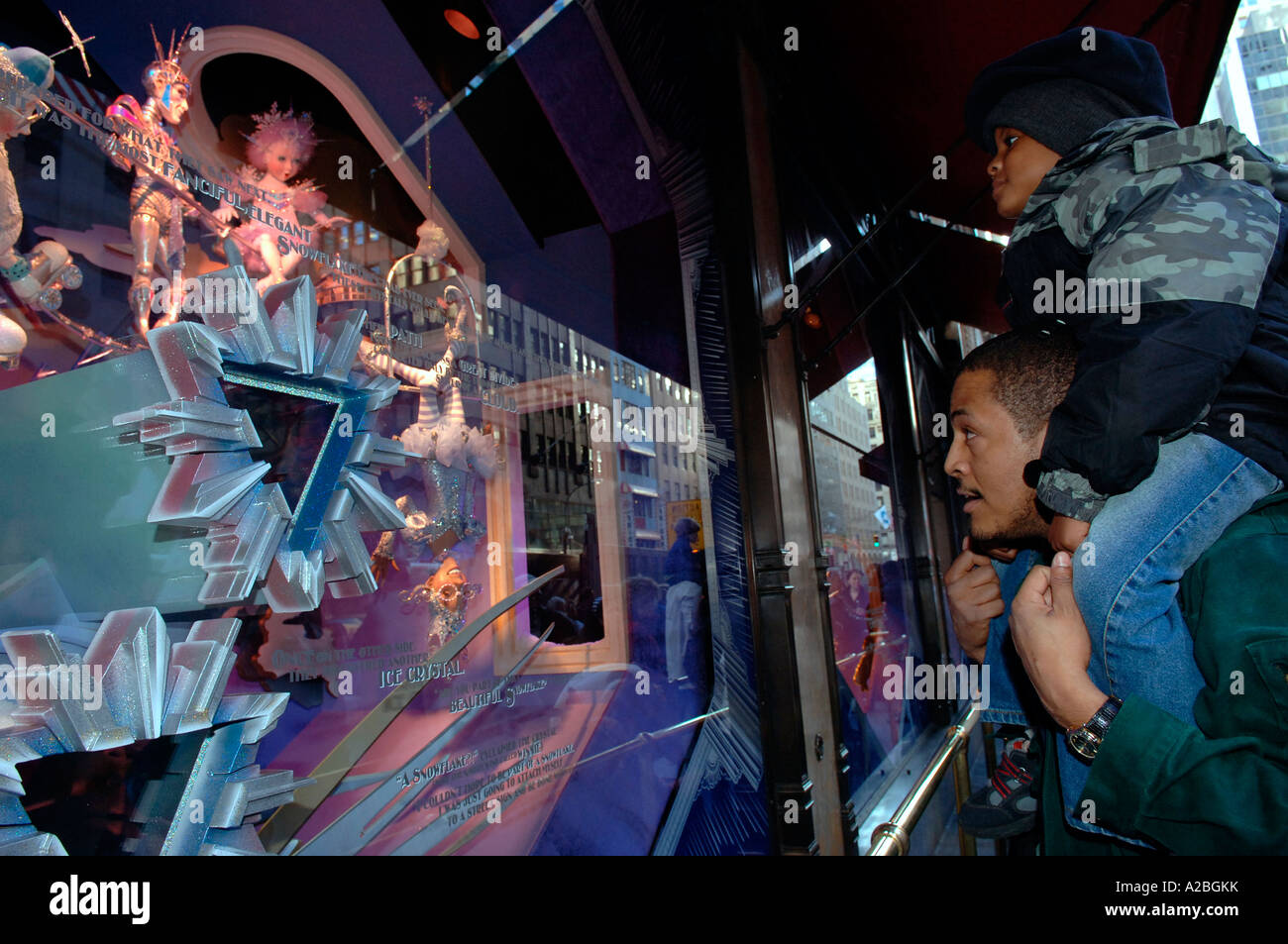 Father and son visit Sak s Fifth Avenue Christmas window display Stock ...