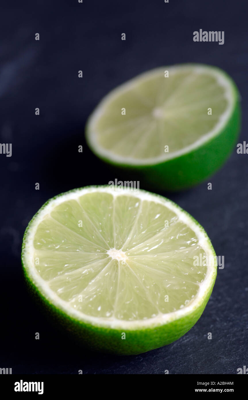Lime opened on slate Stock Photo - Alamy