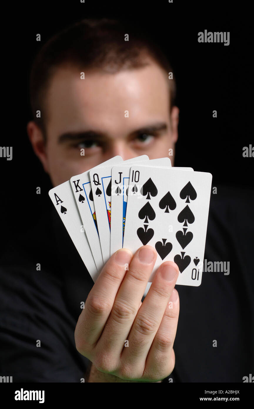 Man showing Royal Flush Stock Photo - Alamy