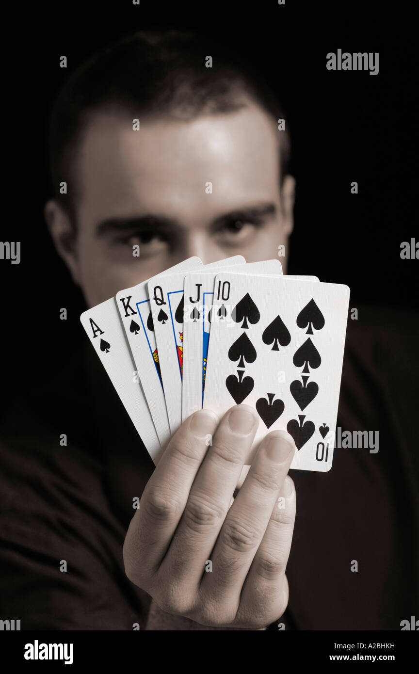 Man showing Royal Flush Stock Photo - Alamy