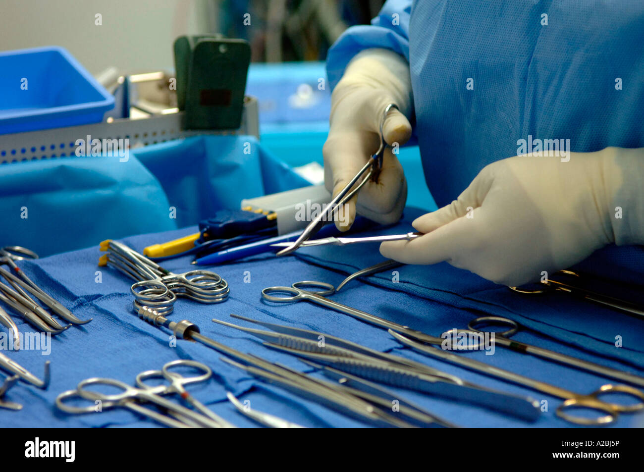 Support staff prepares surgical tools in an operating theater prior to ...