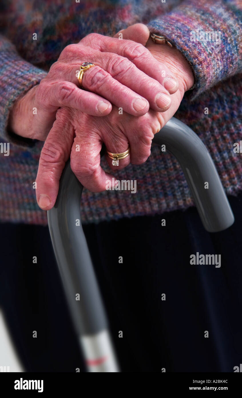Senior womans hands on cane Stock Photo - Alamy