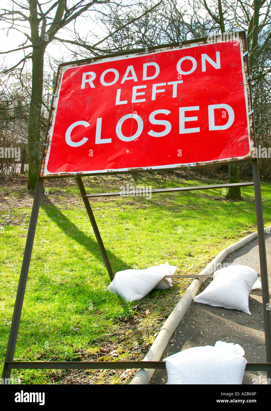 Road on left closed sign Stock Photo - Alamy