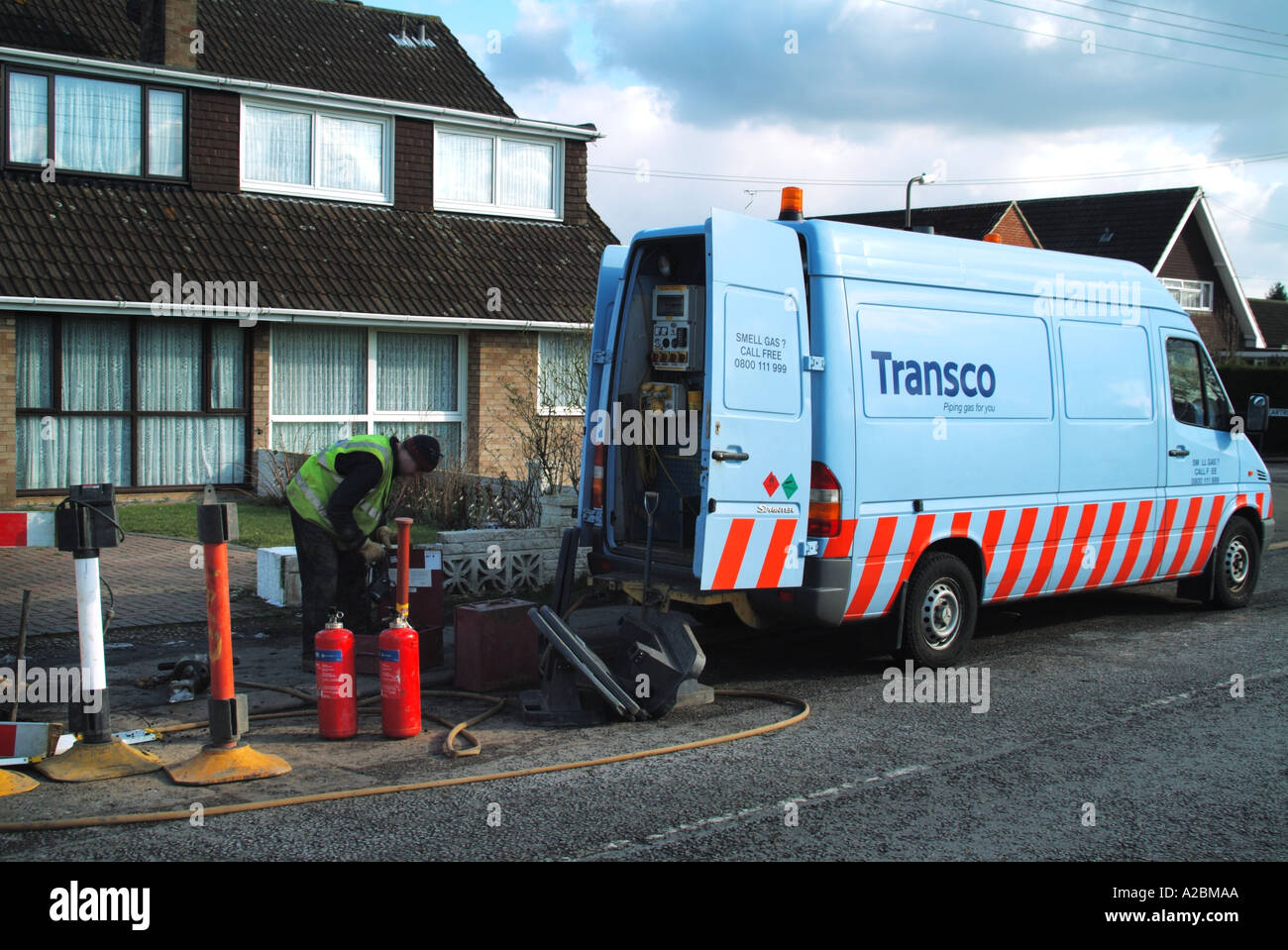 Transco worker beside van investigating & attending to possible ...