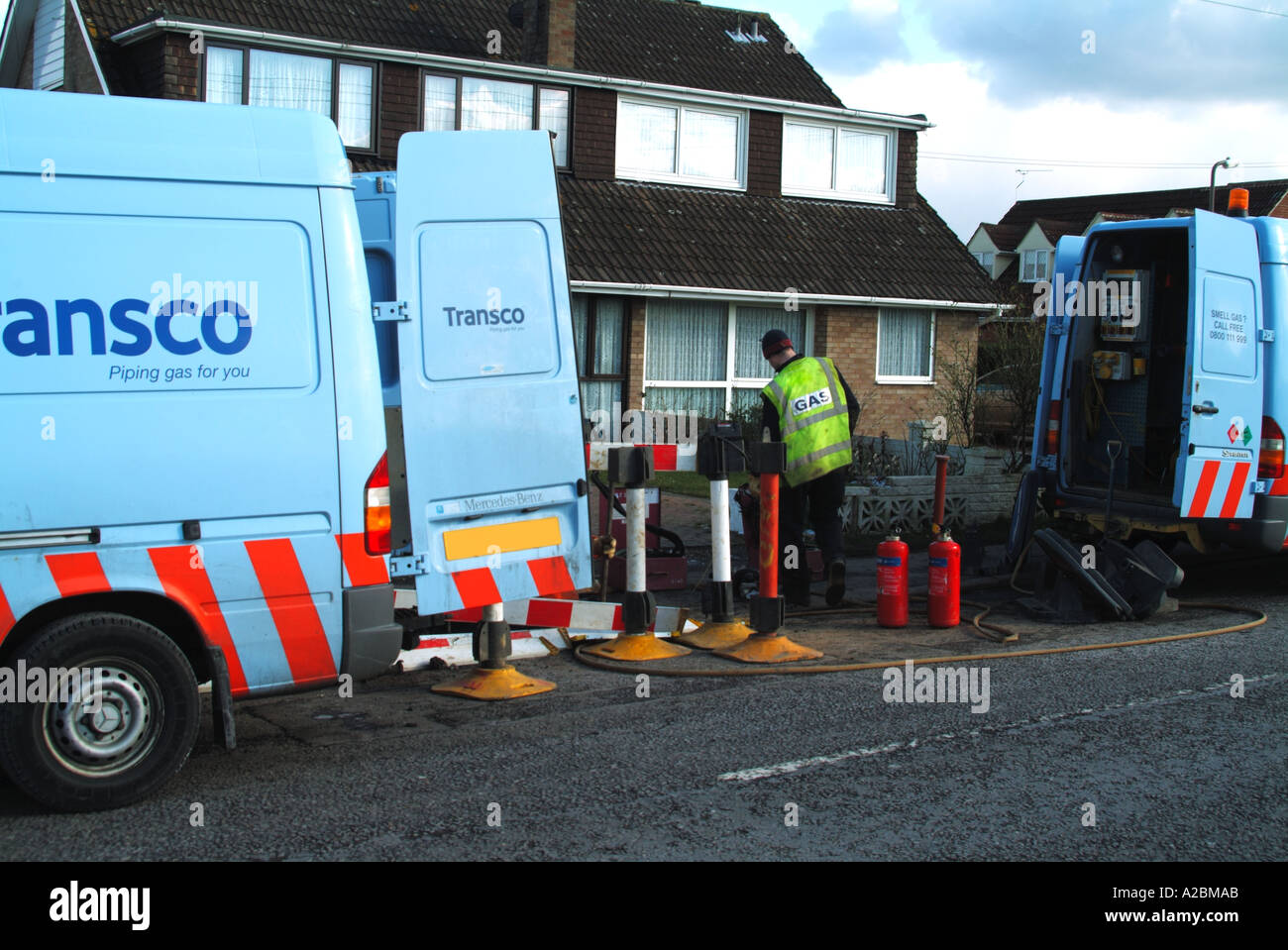 Transco worker beside vans investigating & attending to possible ...