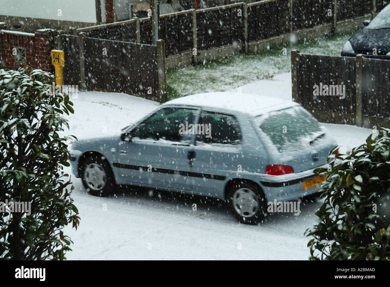 Car driving along during snow fall Stock Photo - Alamy