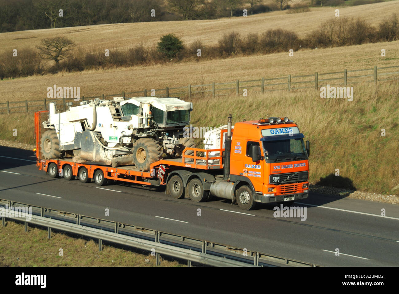 M25 motorway articulated low loader lorry transporting wide heavy ...