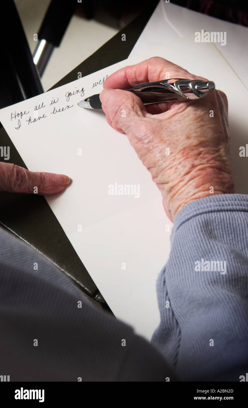 Senior woman writing a letter Stock Photo - Alamy