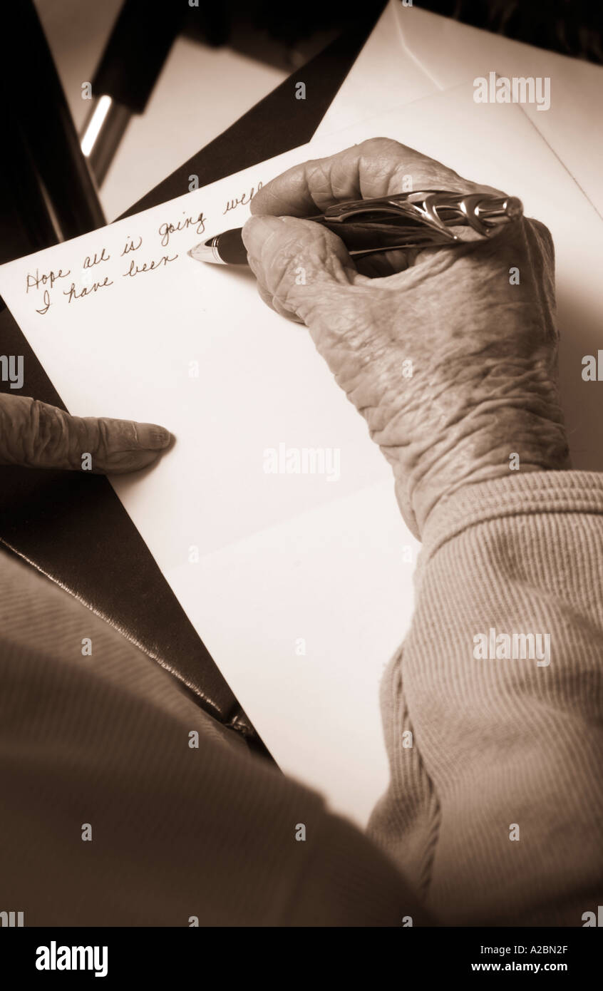 Senior woman writing a letter Stock Photo - Alamy