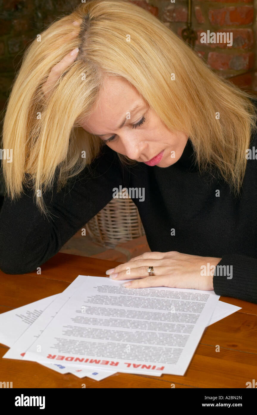 Woman worried about her bills and mortgage payments Stock Photo - Alamy