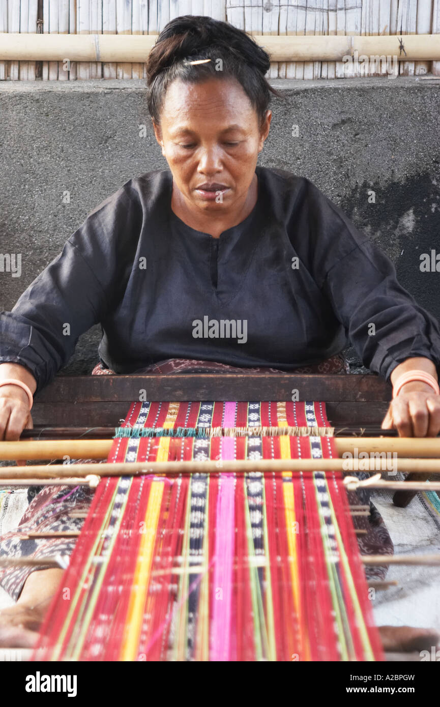 Indonesia, Woman Weaving Cloth Stock Photo - Alamy