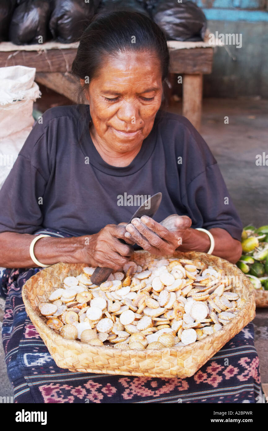 Elderly Woman Cutting Nuts Stock Photo - Alamy