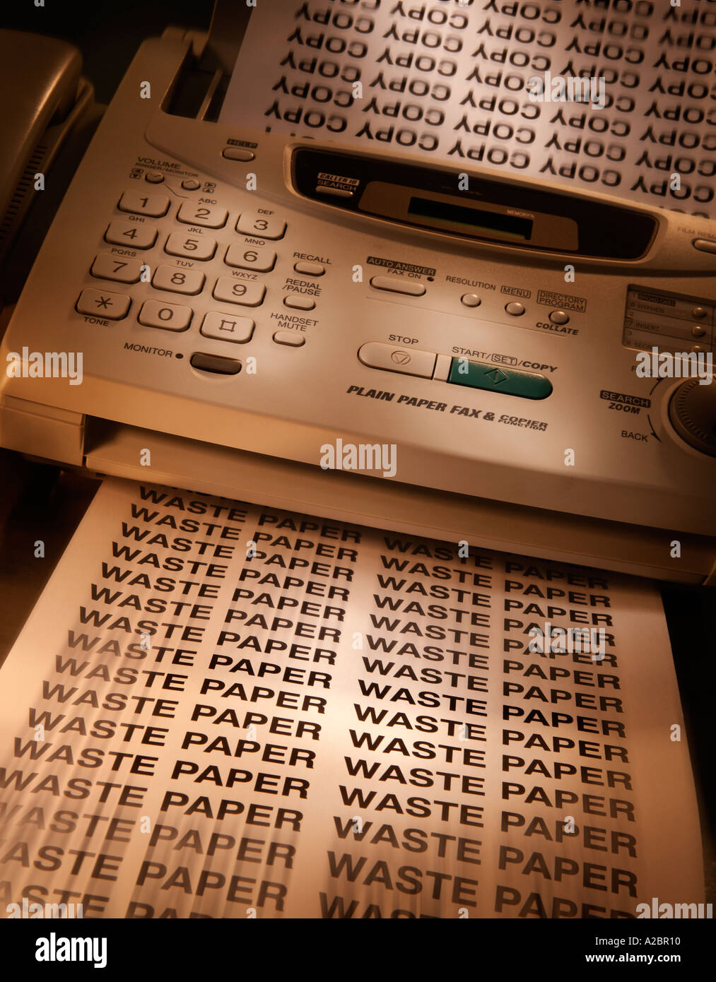 FAX MACHINE PRINTING OUT WASTED COPIES Stock Photo - Alamy