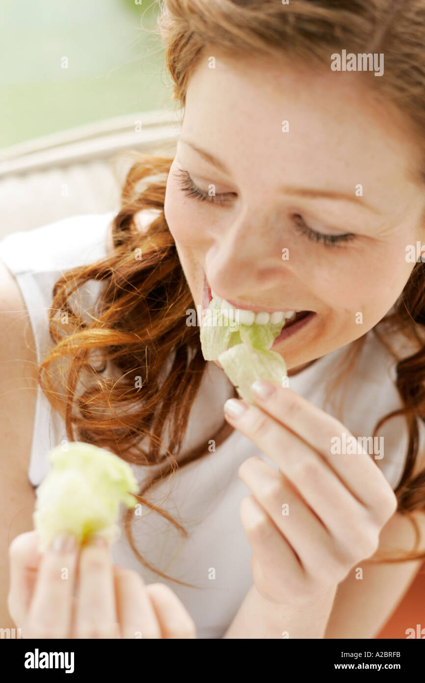 girl eating salad Stock Photo - Alamy