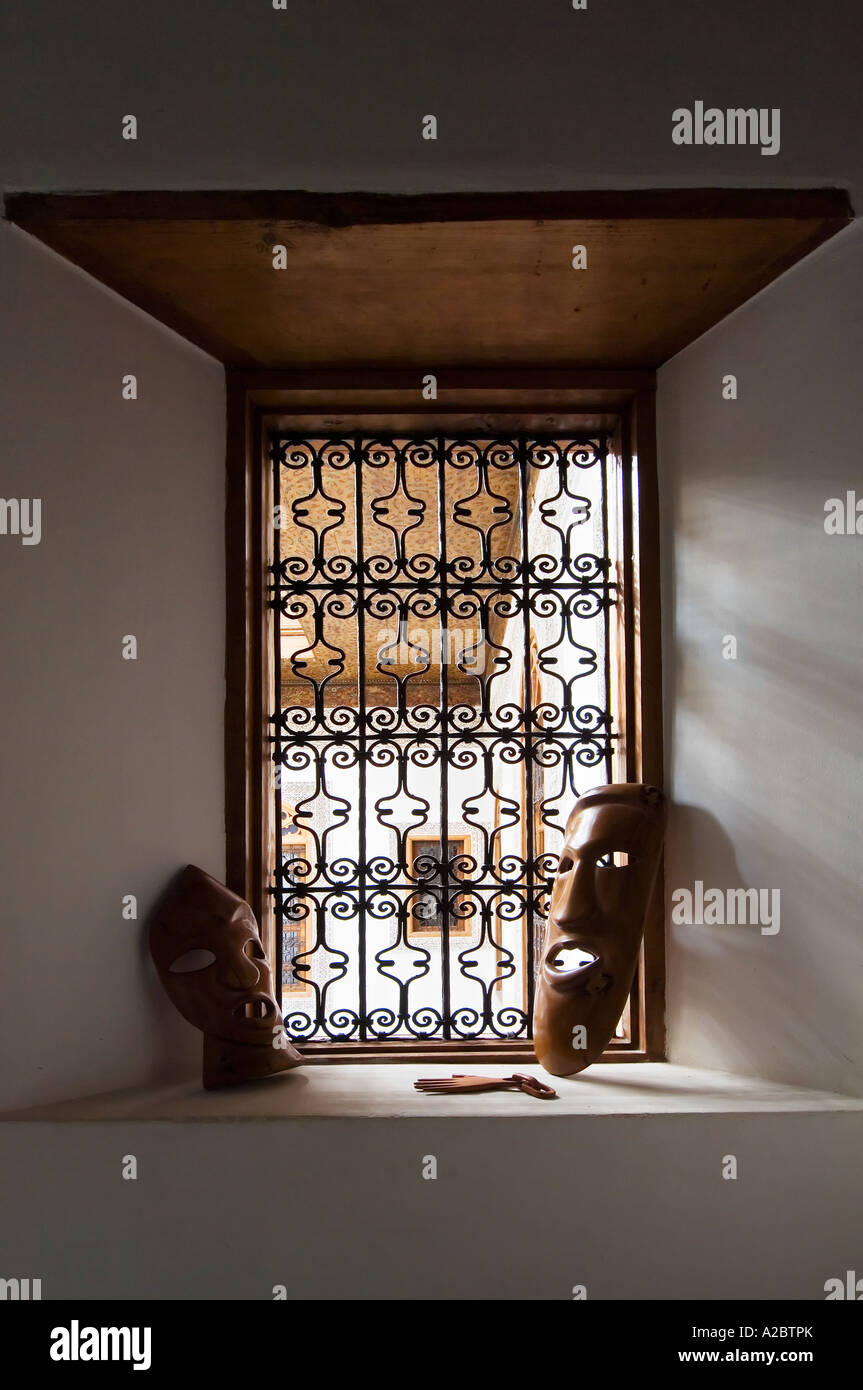 African wooden masks on display in window at Riad Cle De Fes ...