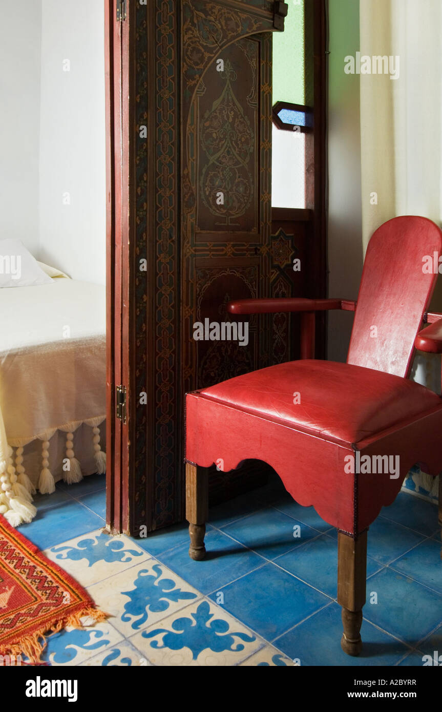 Red leather chair in bedroom of Casa Hassan restored traditional ...