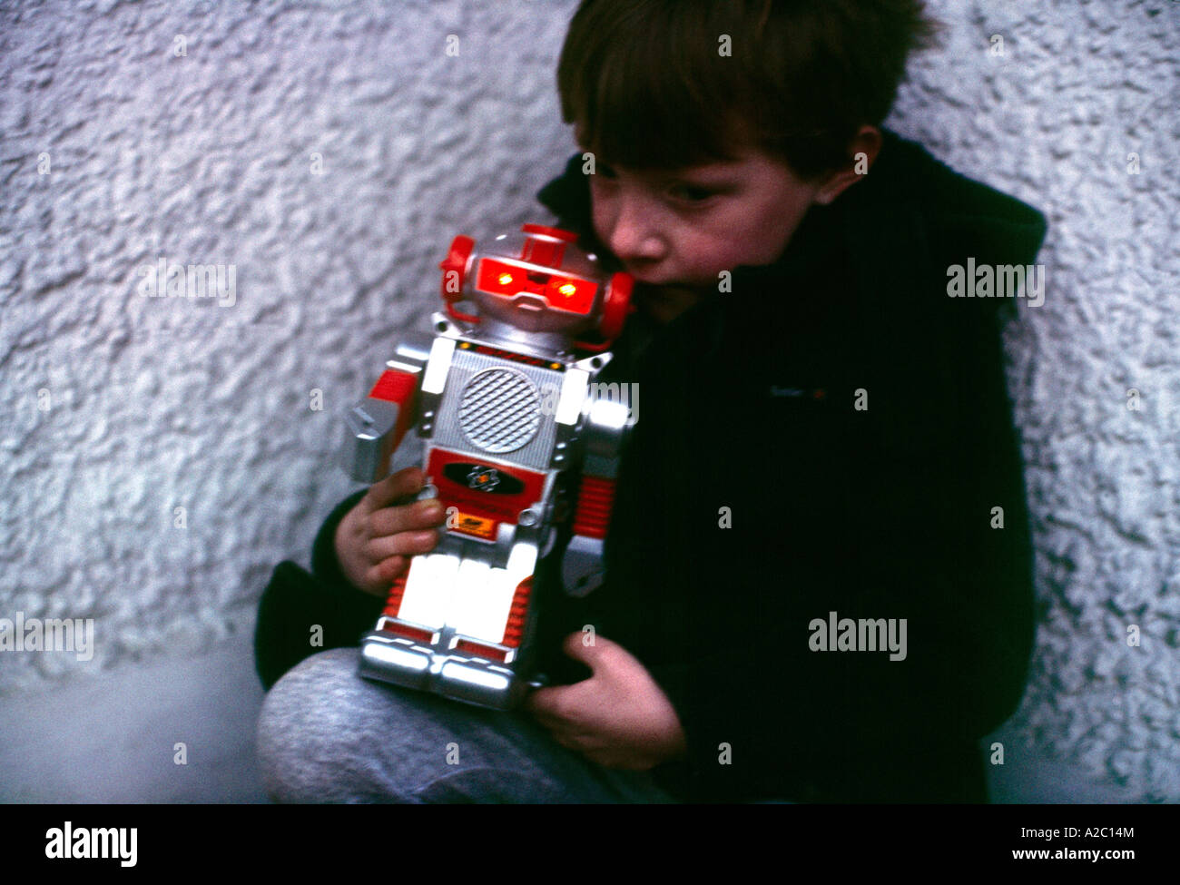Child With Toy Robot Stock Photo - Alamy