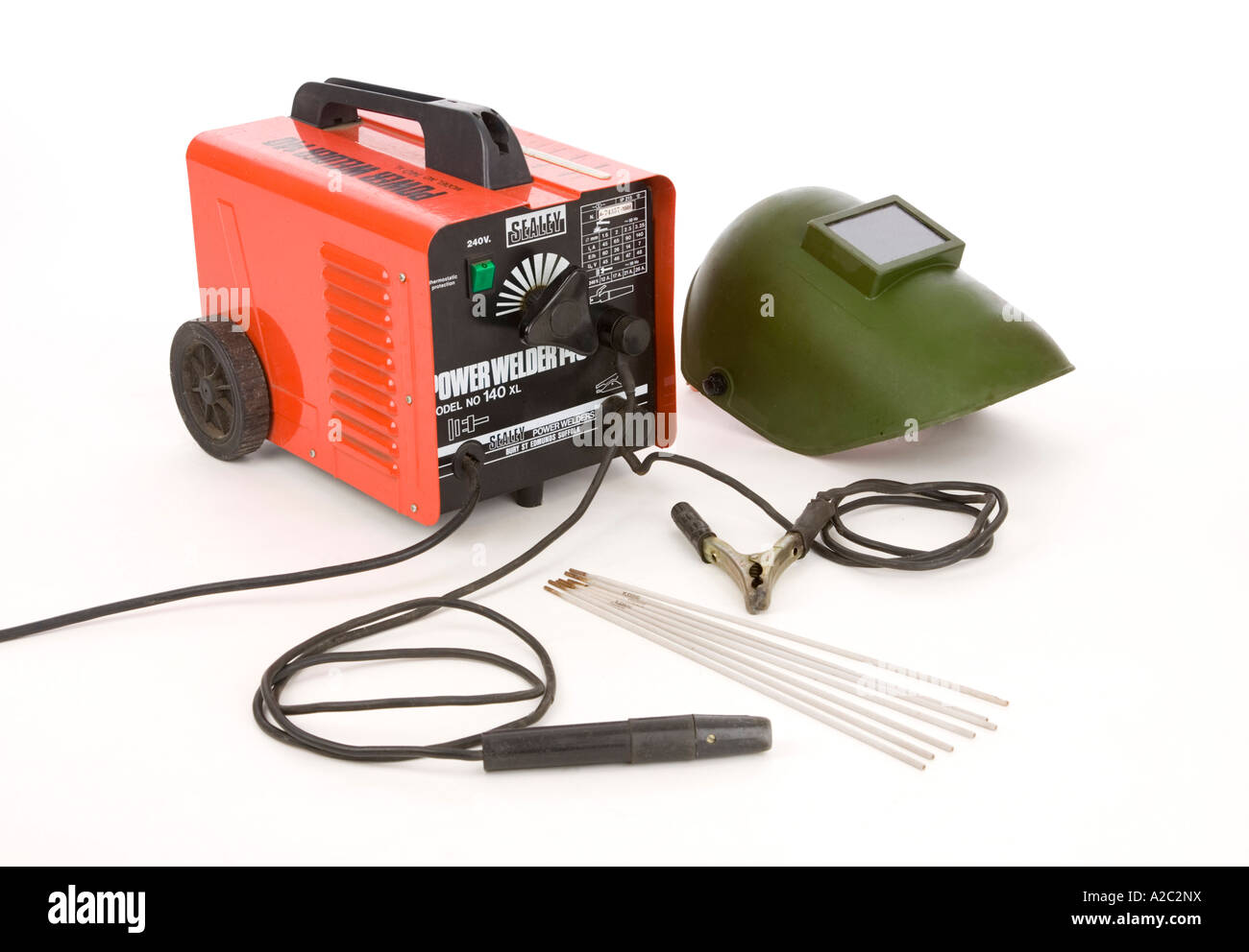 electric arc welder transformer and welding mask and rods Stock Photo ...