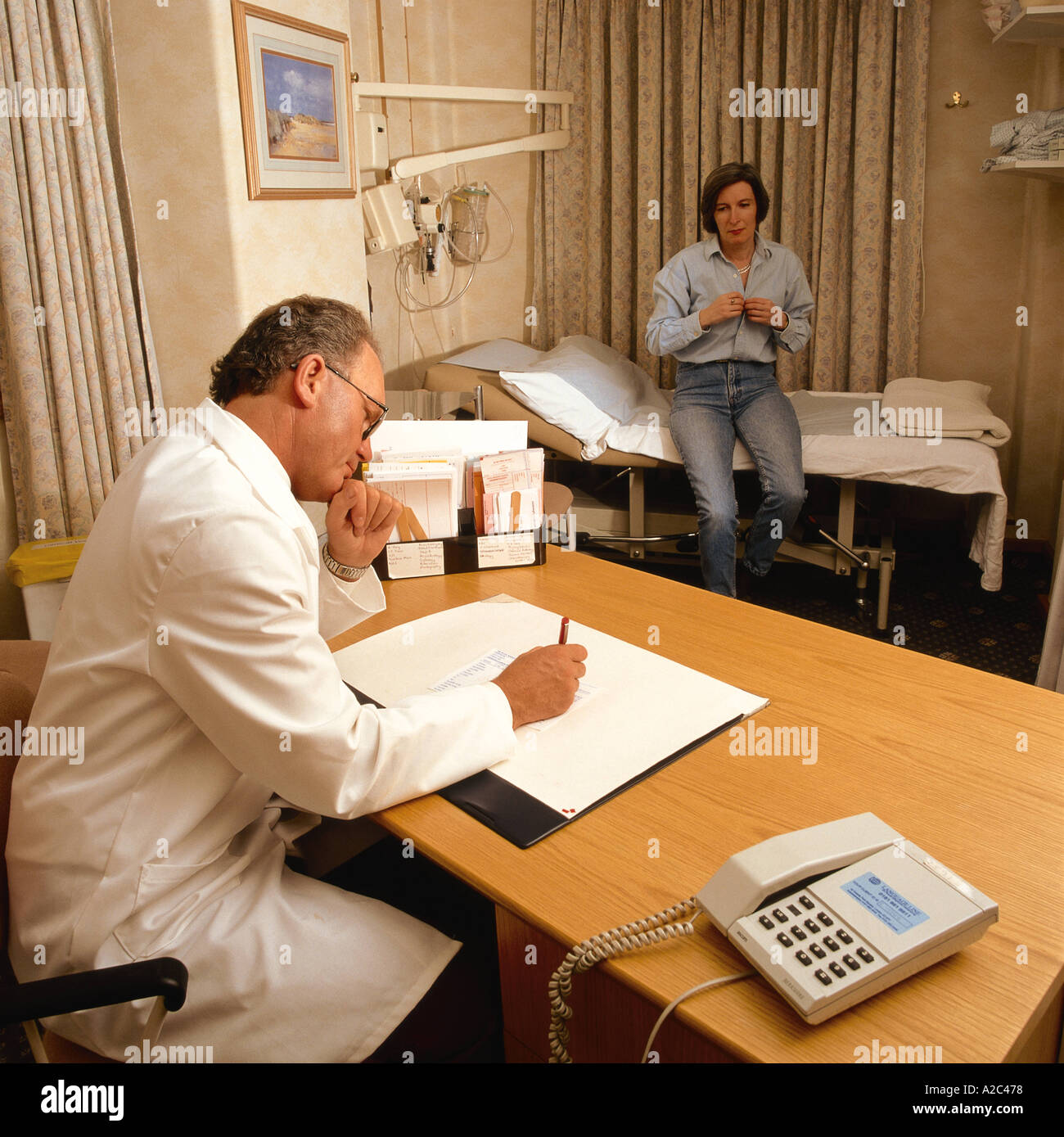 DOCTOR WRITING NOTES ABOUT PATIENT Stock Photo - Alamy