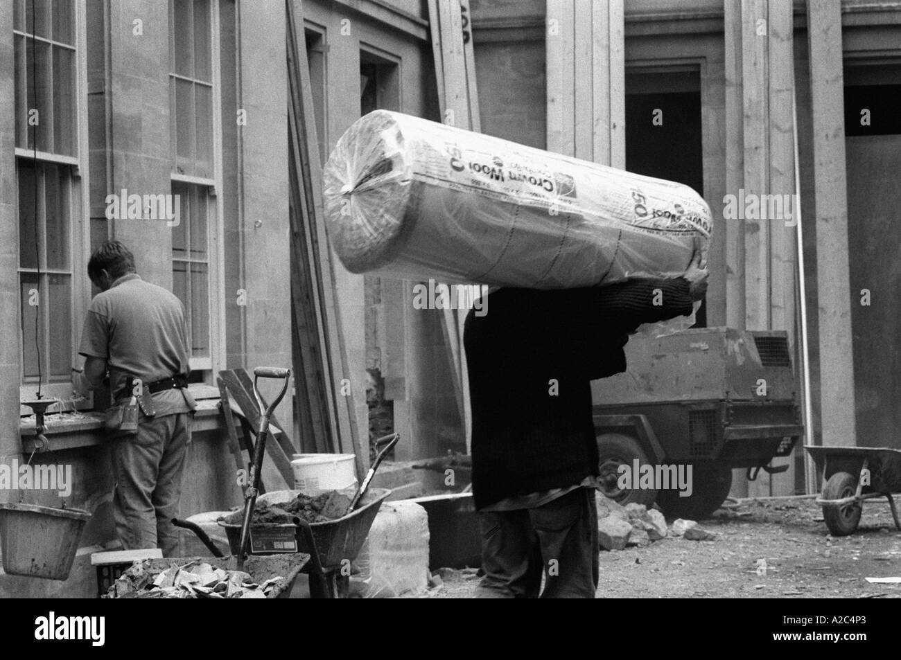 workmen on a building site Stock Photo - Alamy