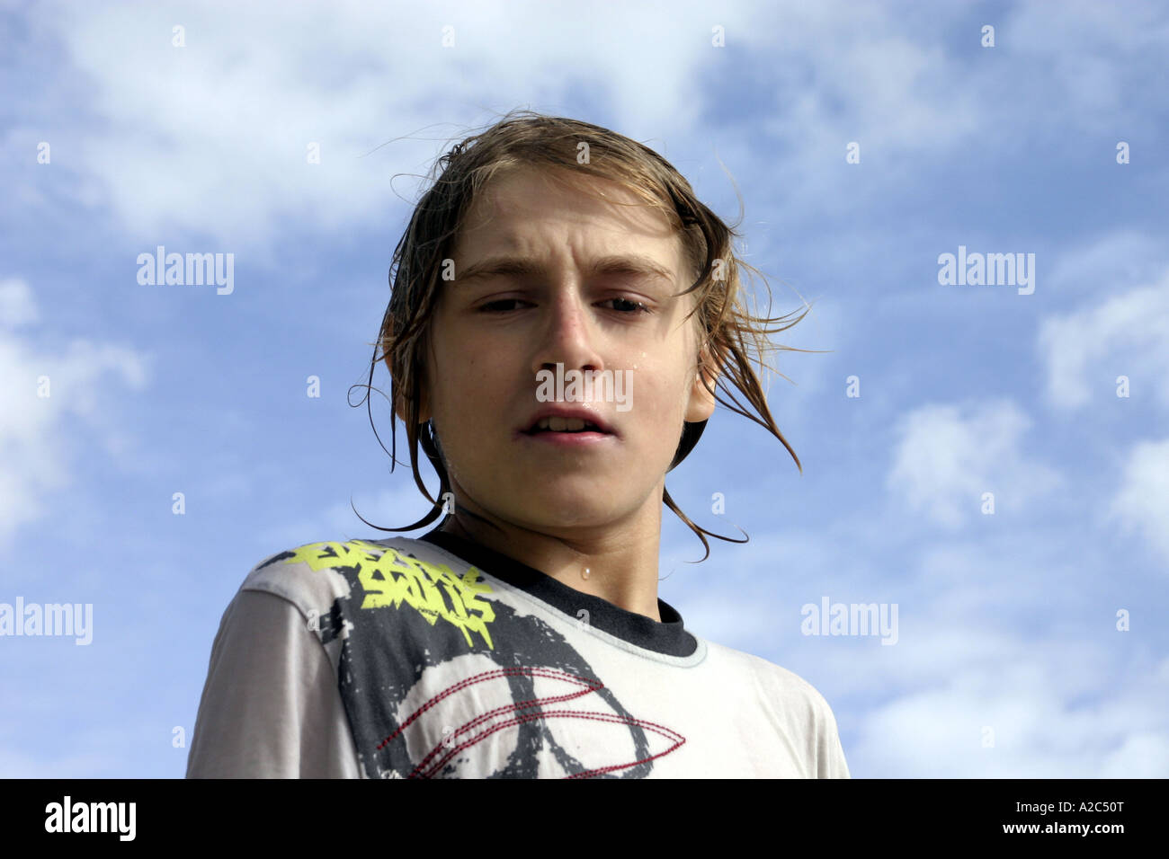 Windswept boy that has been swimming Stock Photo - Alamy
