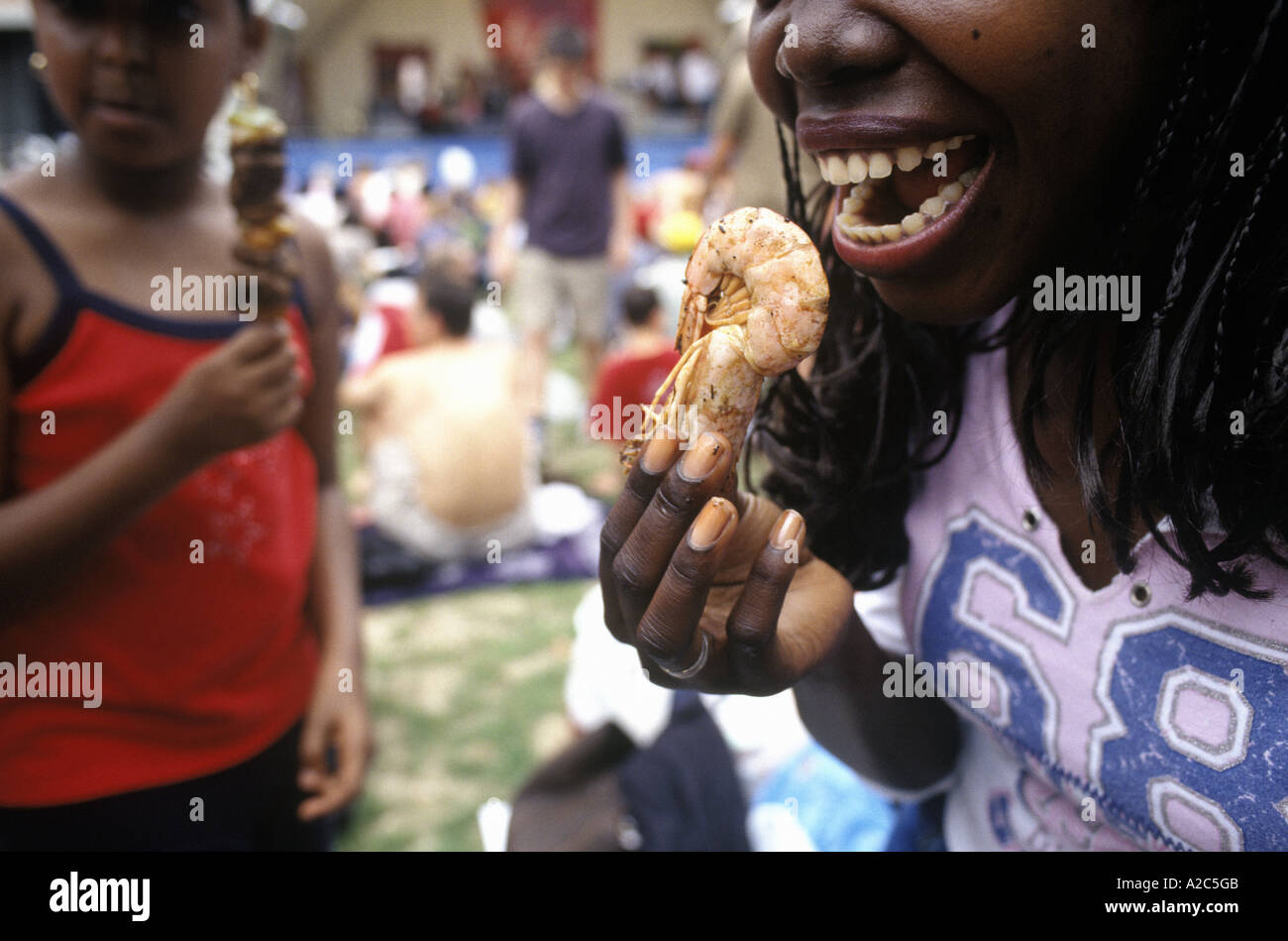 girl eating prawn Stock Photo - Alamy