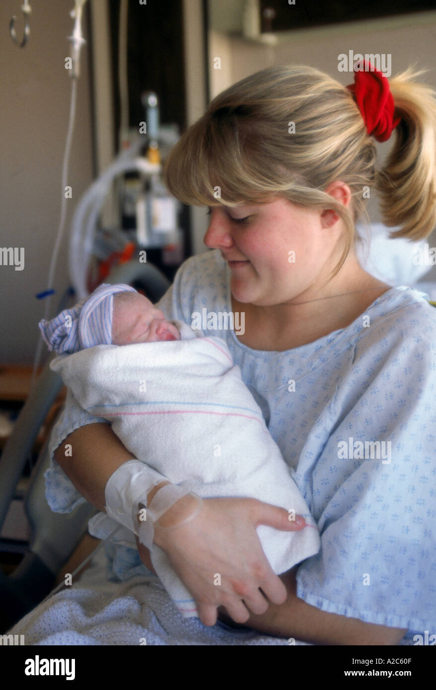 Close-up of teenage mother holding newborn baby Stock Photo - Alamy