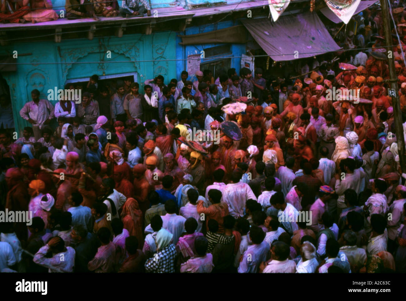 A Holi procession winds through a town in Uttar Pradesh. India as ...