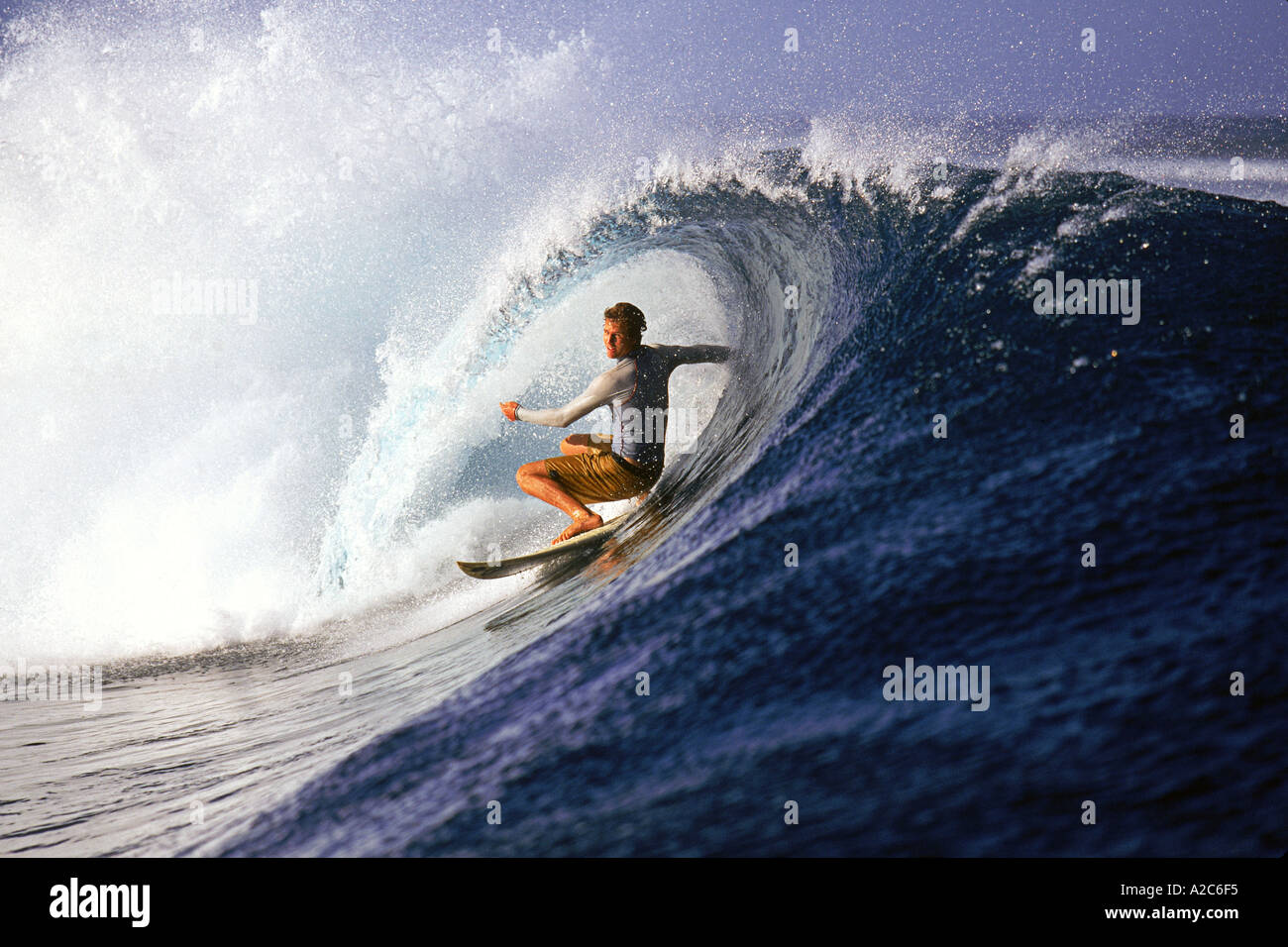 Horizontal shot of surfer surfing inside of wave Stock Photo - Alamy