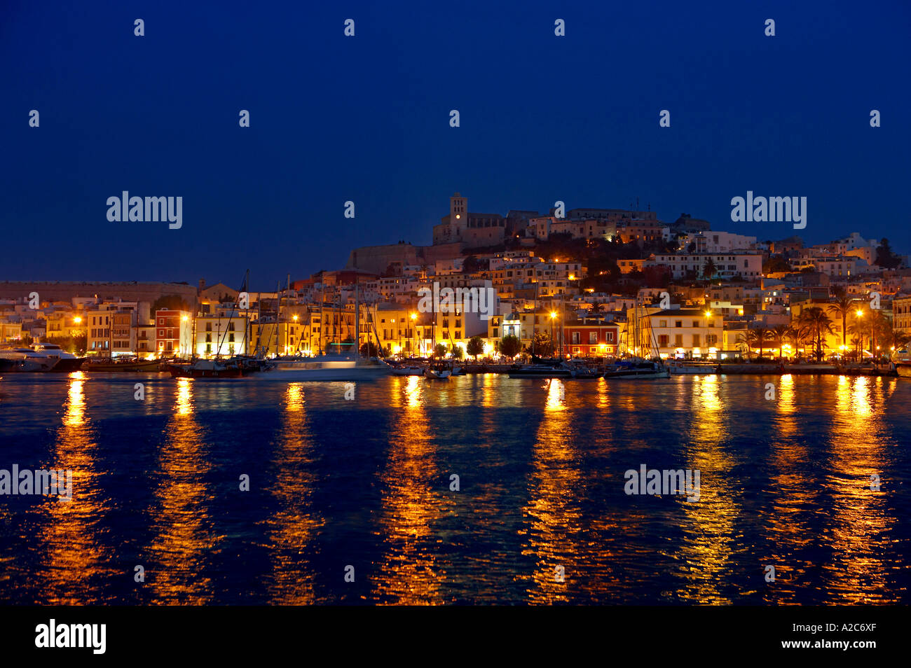 Sunset over harbour in Old Ibiza Town Island of Ibiza Spain Stock Photo ...