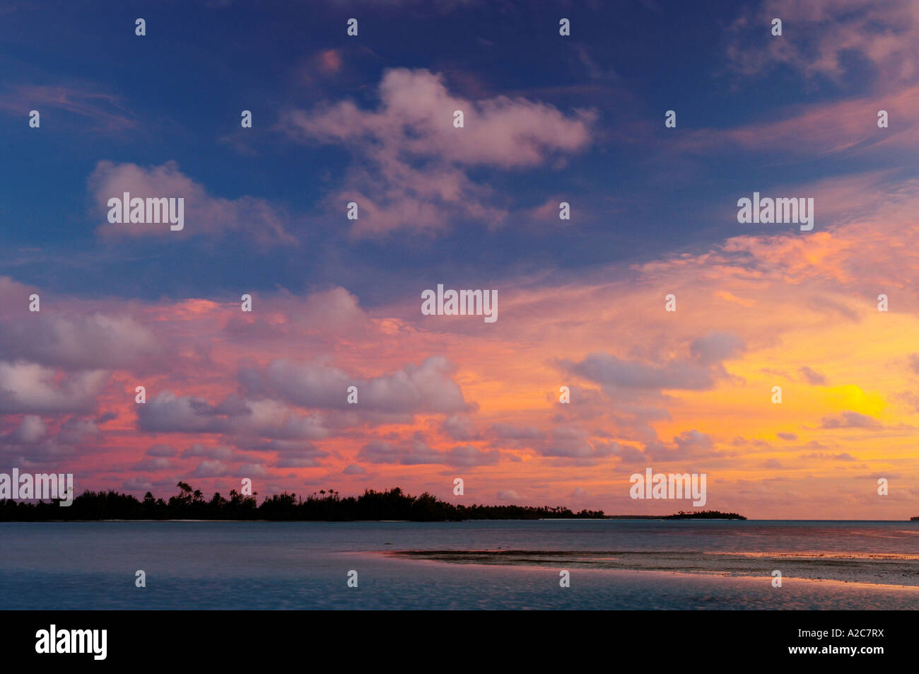 Sunset over Aitutaki in the Cook Islands Stock Photo - Alamy