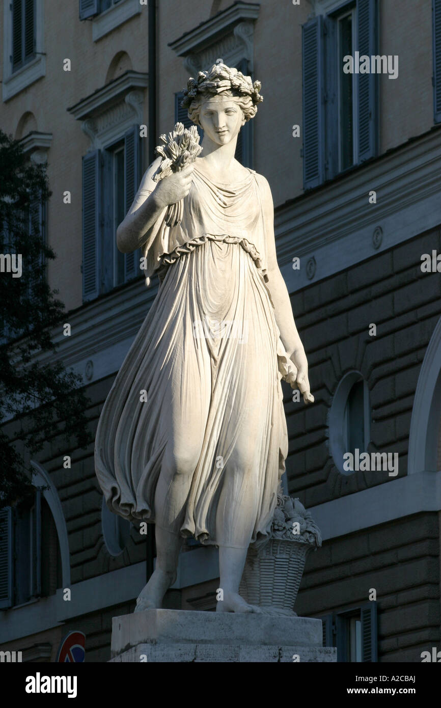 Elegant marble statue of a young woman with flowers in Piazza del ...
