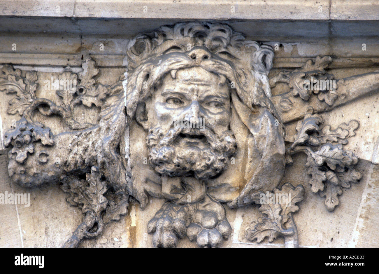 Bas relief figure above building entrance Stock Photo - Alamy