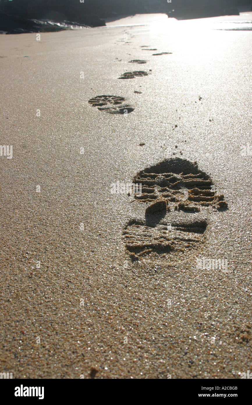 Foot steps in the sand Stock Photo - Alamy