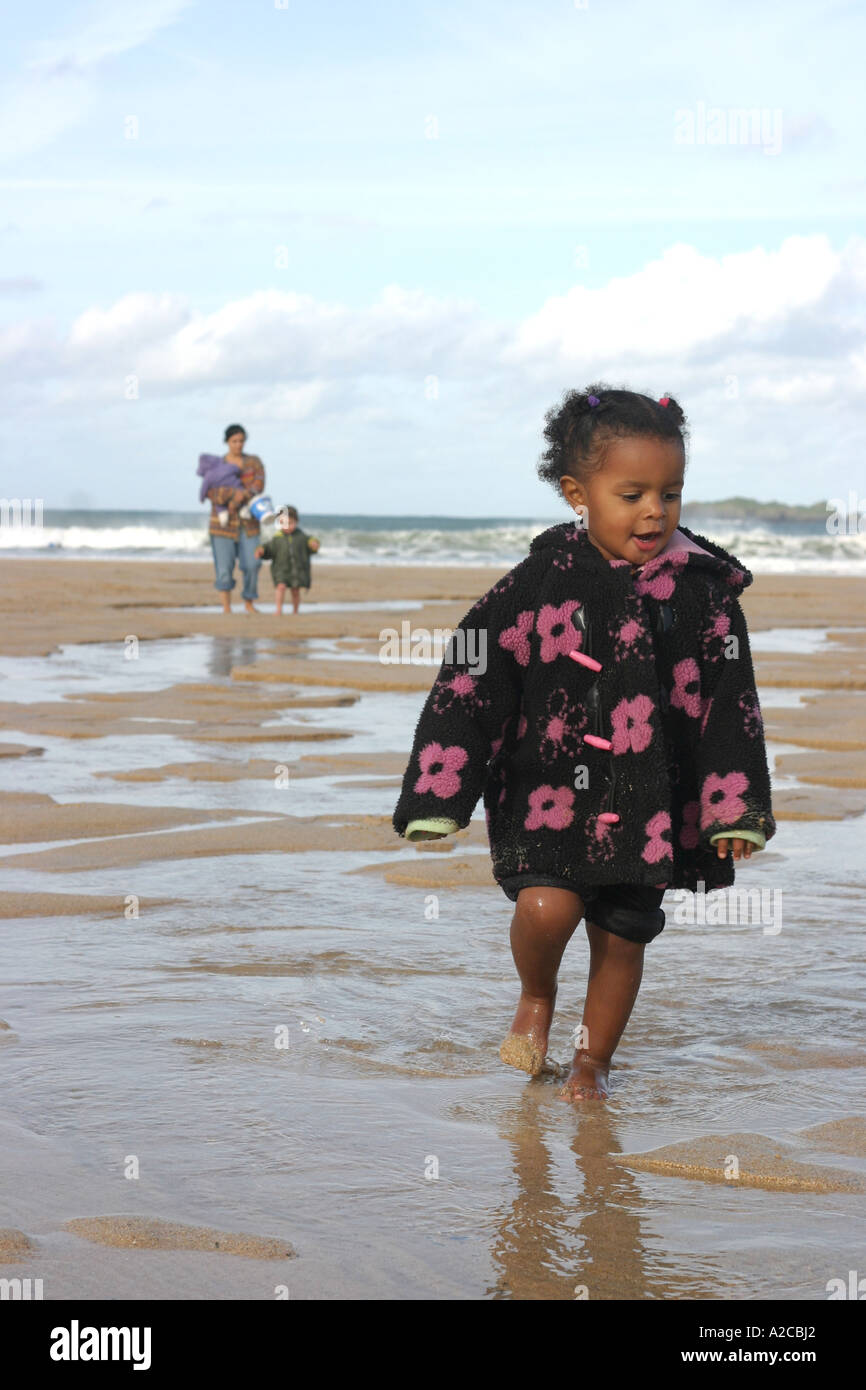 girl running through puddle on beach Stock Photo - Alamy