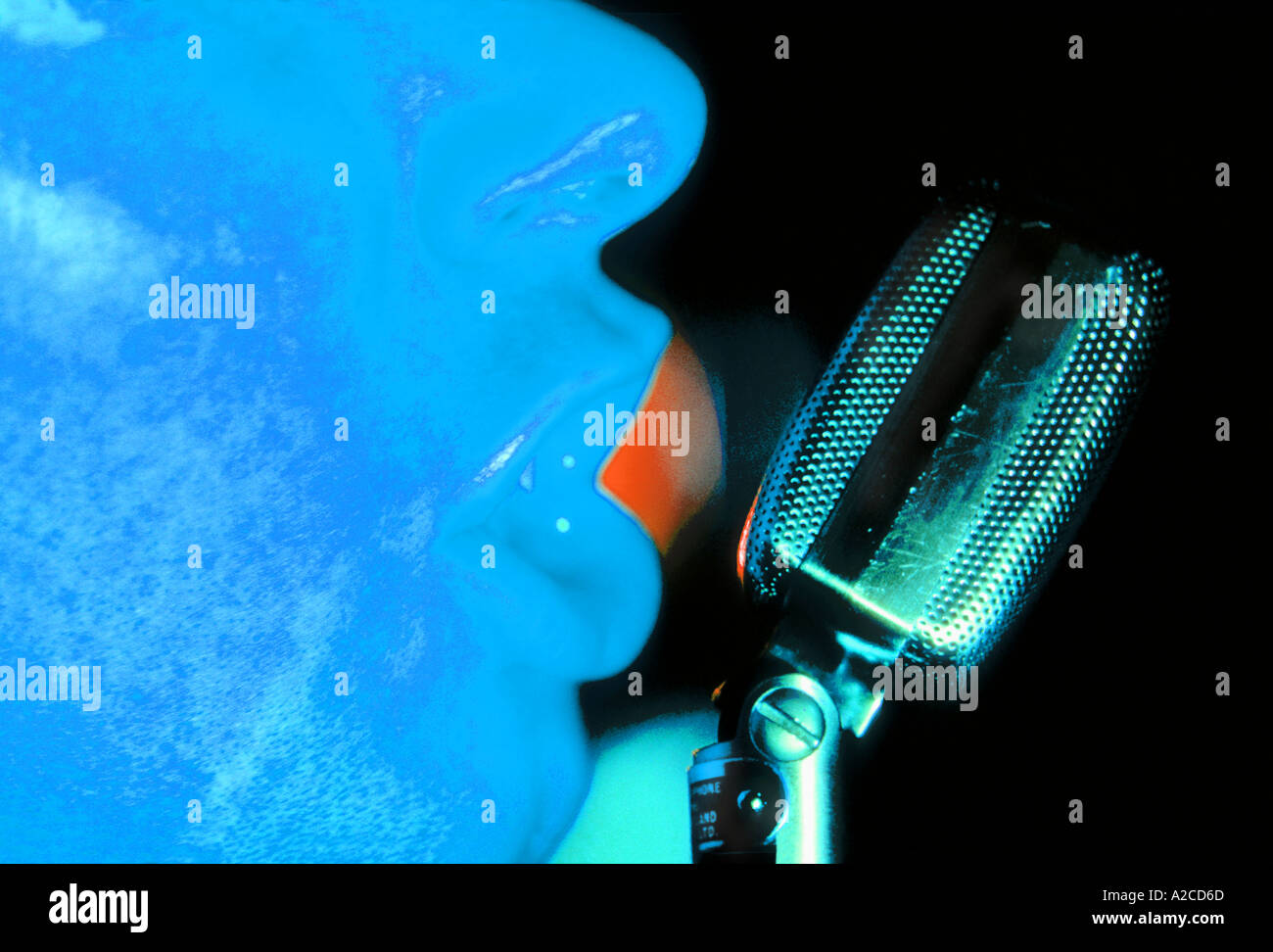Singer with microphone Stock Photo - Alamy