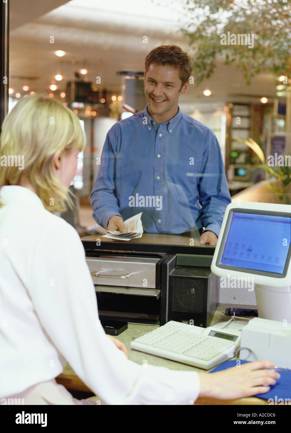 Bank cashier hi-res stock photography and images - Alamy