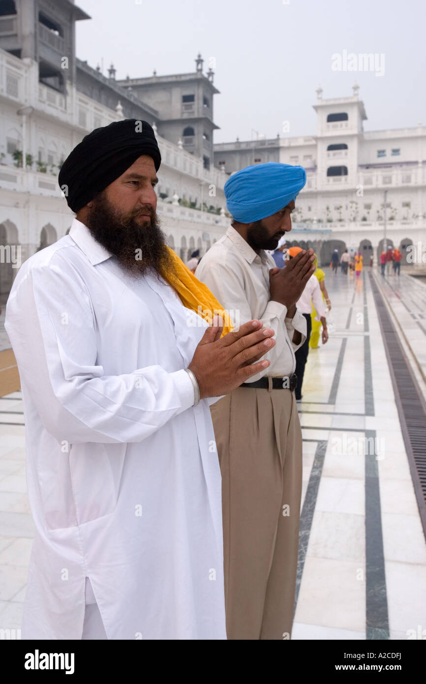 Sikh man praying in the Golden Temple Complex in the Sikh city of ...